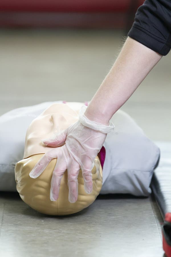First Response Worker Demonstrates CPR and Proper Defibrillator ...