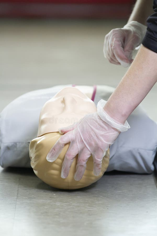 First Response Worker Demonstrates CPR and Proper Defibrillator ...