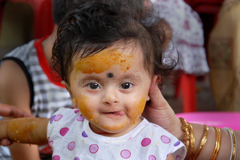 First Rice-eating Ceremony in India Editorial Image - Image of turmeric ...