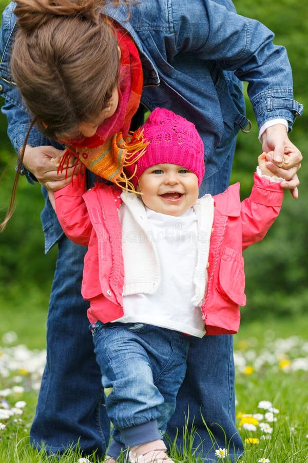 Baby s first steps stock image. Image of baby, flowers - 25866223