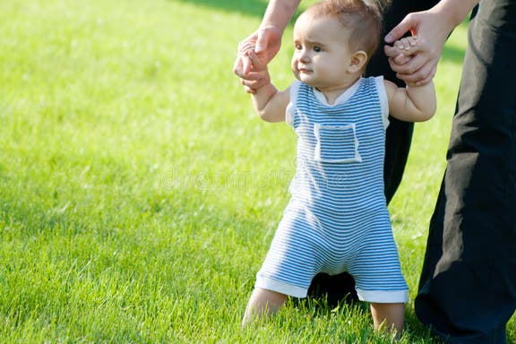 First steps stock image. Image of help, active, legs, parent - 7694699