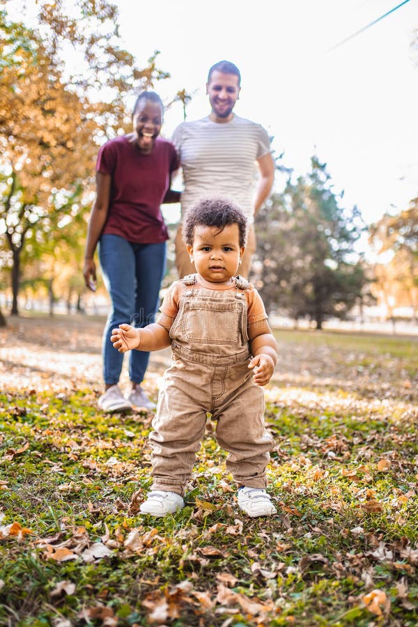 First Steps in Autumn Splendor Stock Photo - Image of parents, adult ...