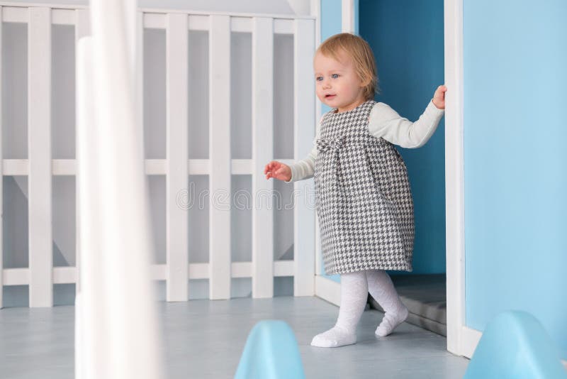 First Steps of Baby Girl Learning To Walk in White Sunny Bedroom Stock ...