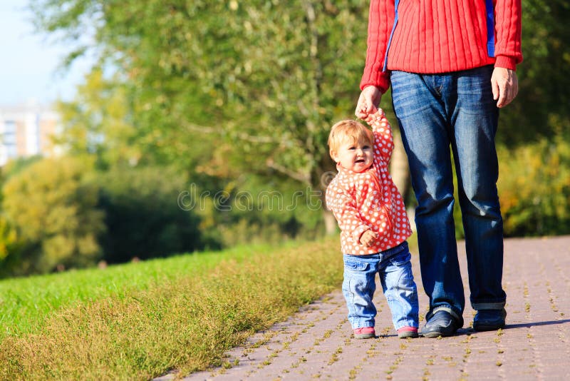 First Steps of Cute Little Girl in Autumn Park Stock Photo - Image of ...