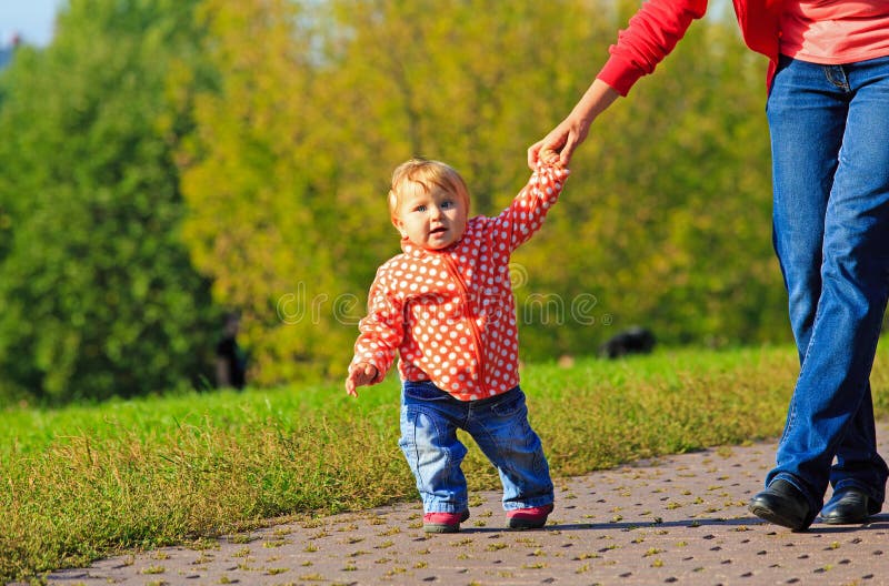 First Steps of Cute Little Girl in the Park Stock Image - Image of ...