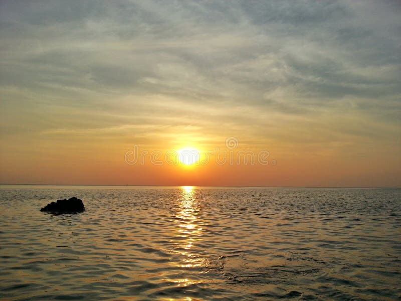 First Sunset Time for Year 2015 Stock Photo - Image of beach, cloud ...