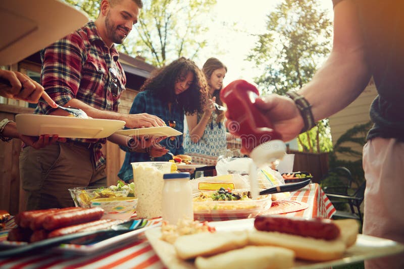 The First Taste of Summer. a Group of Friends Having Lunch in Their ...