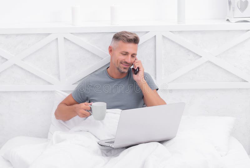 Happy Guy Talk on Cellphone in Bed. Mobile Communication Stock Image ...
