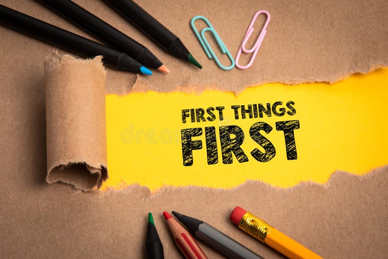 First Things First. Torn Cardboard and Office Supplies Stock Image ...