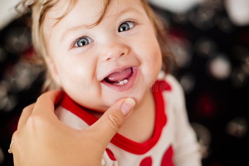First tooth in a child. stock photo. Image of closeup - 117753542
