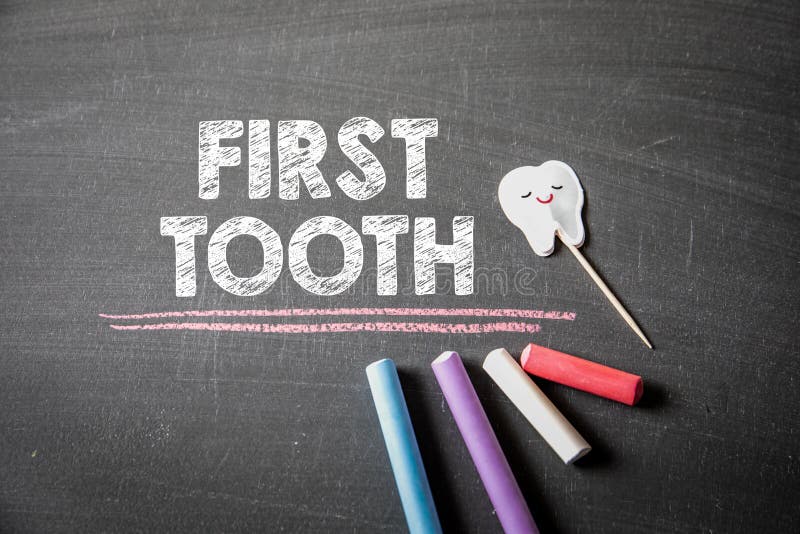 First Tooth. Text and Colored Chalk on a Dark Board Stock Photo - Image ...