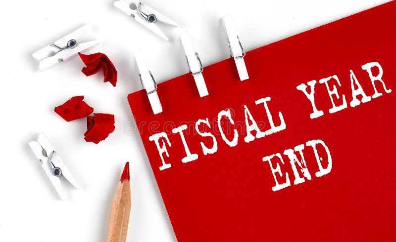 FISCAL YEAR END Text on the Red Paper with Office Tools on White ...