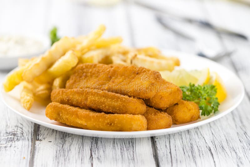 Fisch Sticks (close-up Shot) on an Old Wooden Table Stock Image - Image ...