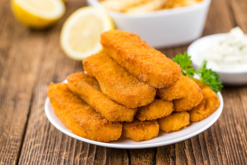 Fisch Sticks (close-up Shot) on an Old Wooden Table Stock Image - Image ...