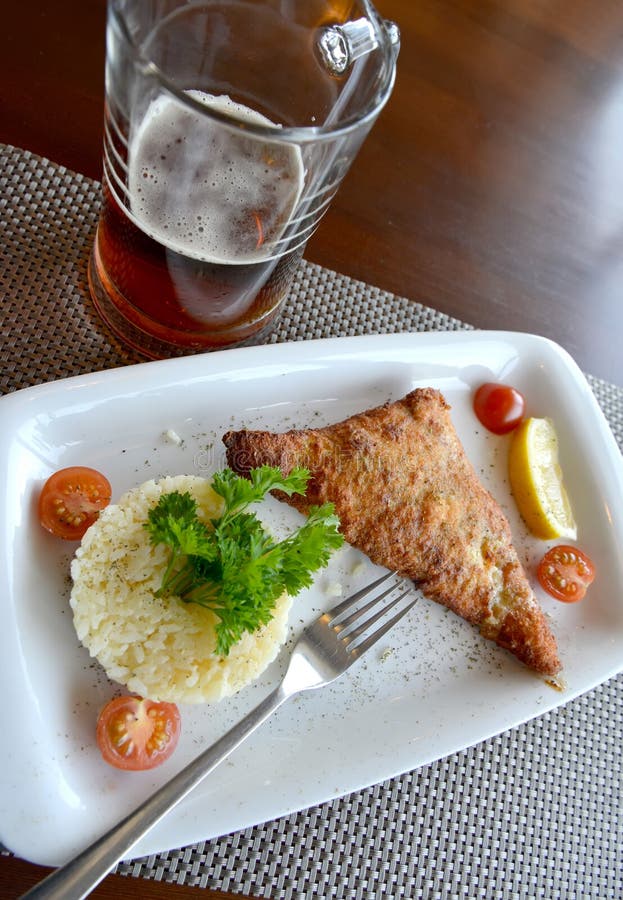 The Fish Baked in Batter with Rice and Vegetables Stock Photo - Image ...