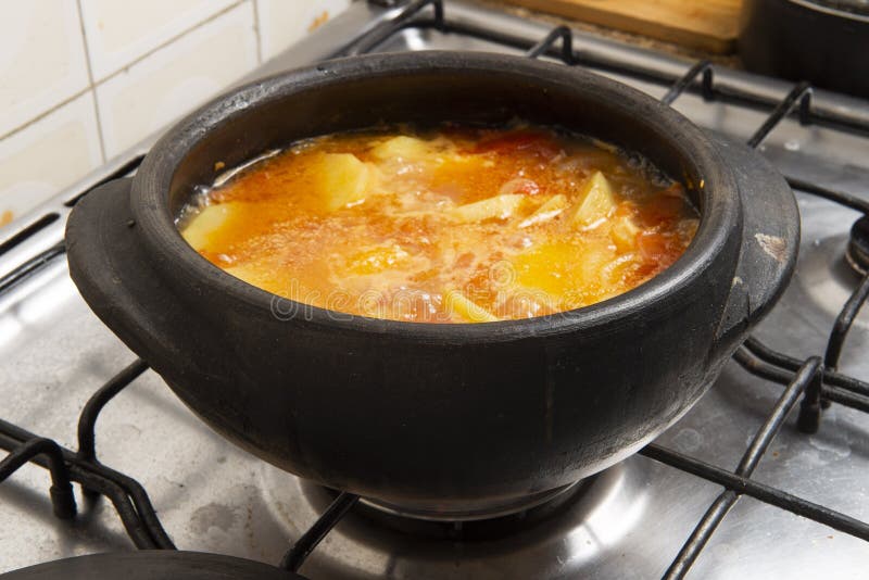 Fish Being Cooked in a Clay Pot Stock Image - Image of green, plate ...