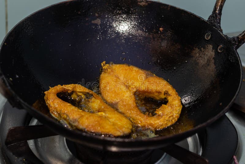 Fish being fried stock image. Image of meal, cooking - 234472133