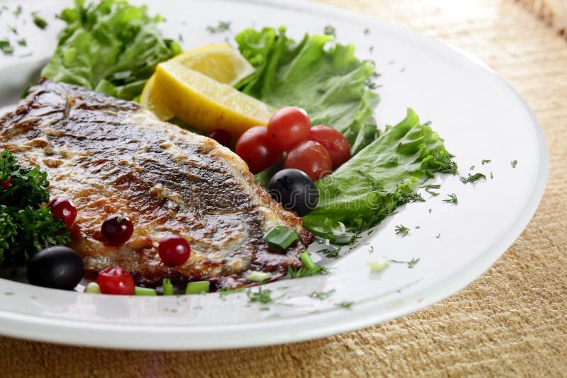 Fish with berries stock photo. Image of food, main, grilled - 25320018