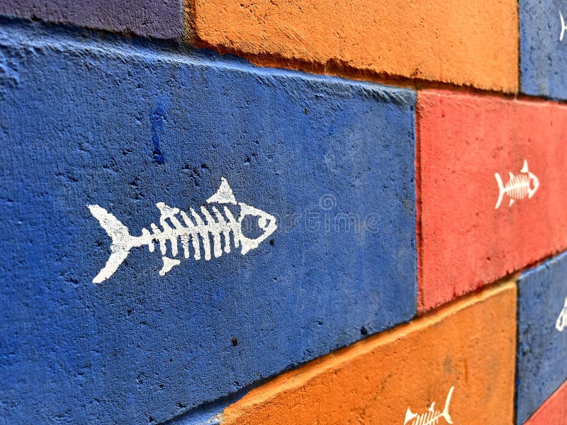 Fish Bone Graffiti on a Brick Wall Stock Photo - Image of colored ...