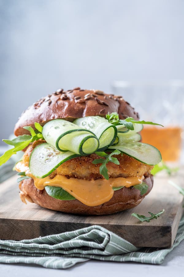 Fish burger with cucumber stock image. Image of burger - 183247115