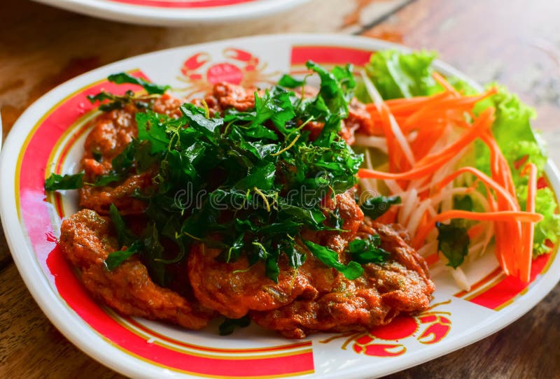 Fish Cake in a Plate on a Table with Vegetables. Stock Image - Image of ...