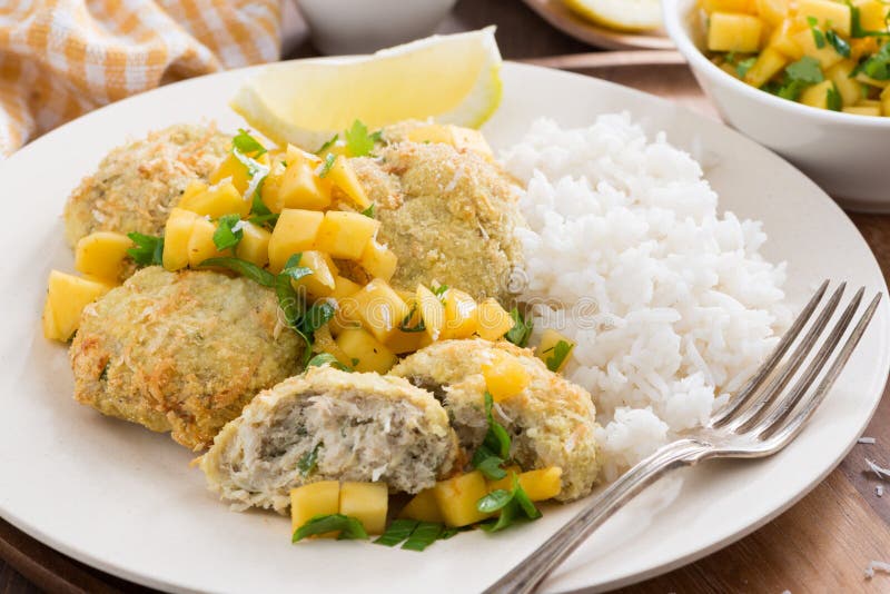 Fish Cakes with Mango Salsa and Rice, Close-up Stock Image - Image of ...