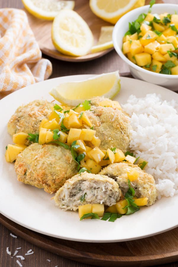 Thai Fish Cakes with Mango Salsa and White Rice Stock Photo - Image of ...