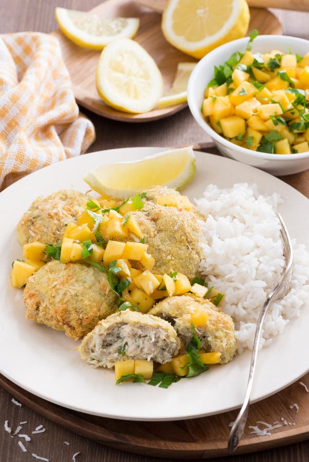 Fish Cakes with Mango Salsa and White Rice, Top View Stock Photo ...