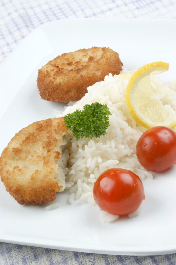 Fish Cakes with Rice and Tomatoes Stock Photo - Image of rice, child ...