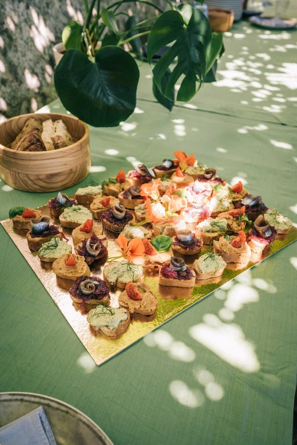 Fish canapes on a table stock photo. Image of plate - 329458118