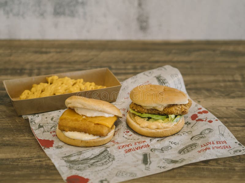 Fish and Chicken Burger with a Tray of Cheese Fries Stock Photo - Image ...