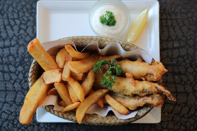 Fish and chips on a plate stock photo. Image of food - 135478786