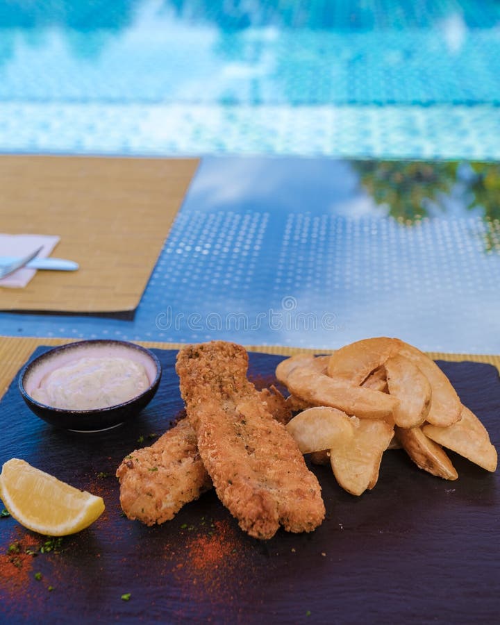 Fish and Chips on a Plate Isolated by the Pool Stock Photo - Image of ...