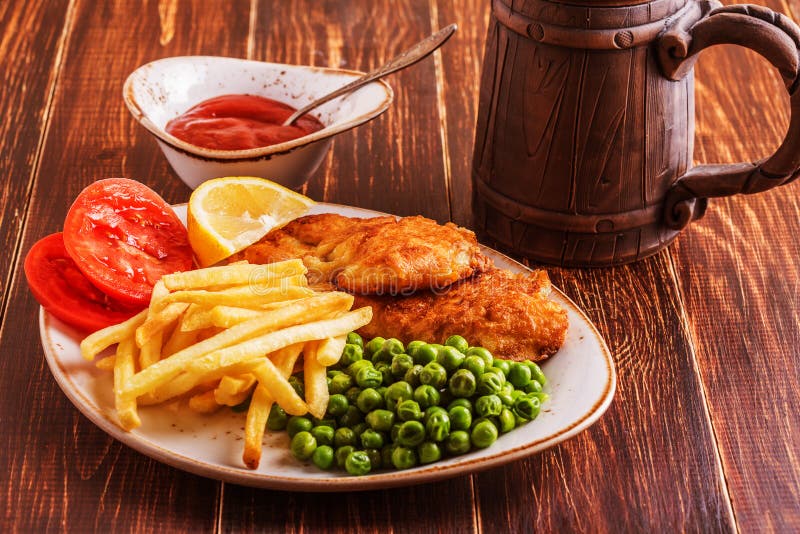 Fish and chips stock image. Image of lemon, green, garnish - 57445907
