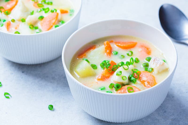 Fish Cod Chowder Soup with Green Peas, Potatoes and Carrots in White ...