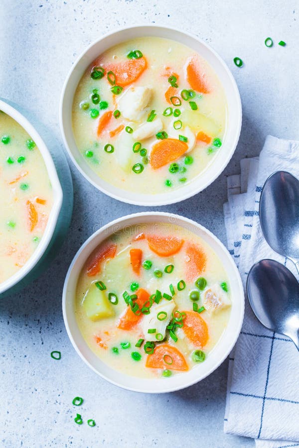 Fish Cod Chowder Soup with Green Peas, Potatoes and Carrots in White ...