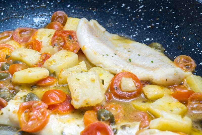 Fish Cooked in a Pot, Cod with Red Tomato and Potatoes Stock Photo ...