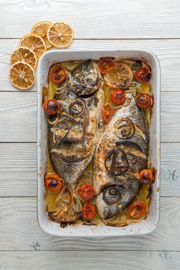 Fish cooked in the oven stock image. Image of dish, cooked - 138247631
