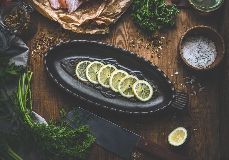 Fish Cooking Concept. Baking Pan in Fish Shape with Lemon Slices on ...