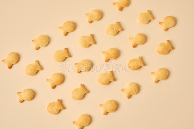 Fish Crackers on Beige Background Top View Stock Photo - Image of ...
