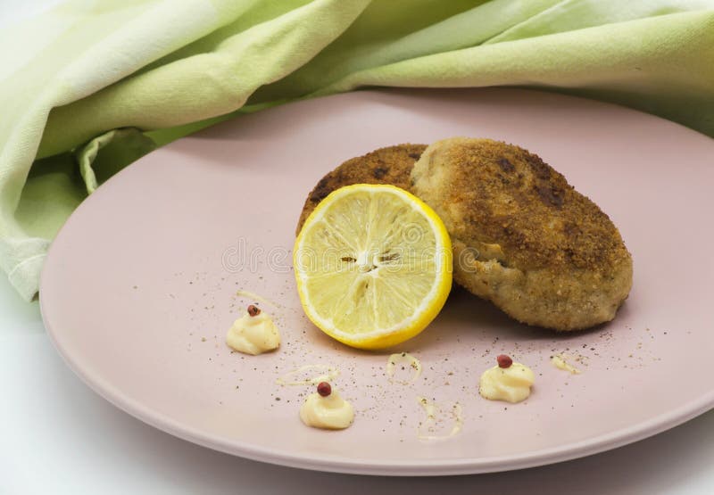 Fish cutlets on a plate stock photo. Image of people - 265960174