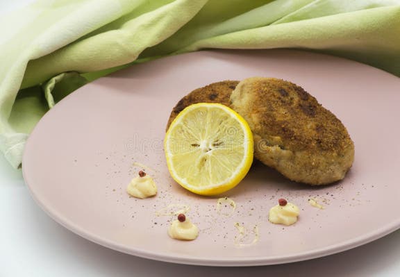 Fish cutlets on a plate stock photo. Image of people - 265960174