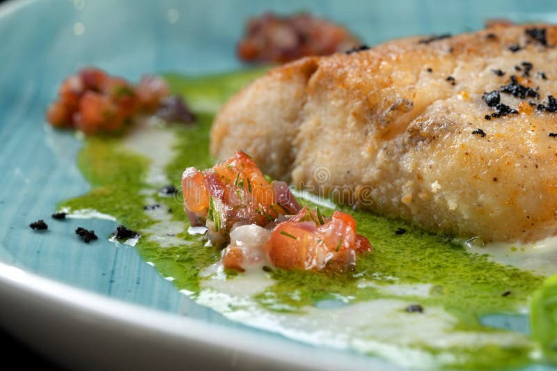 The Fish Dish is Fried Fillets with Tomatoes. Restaurant Dish, High ...