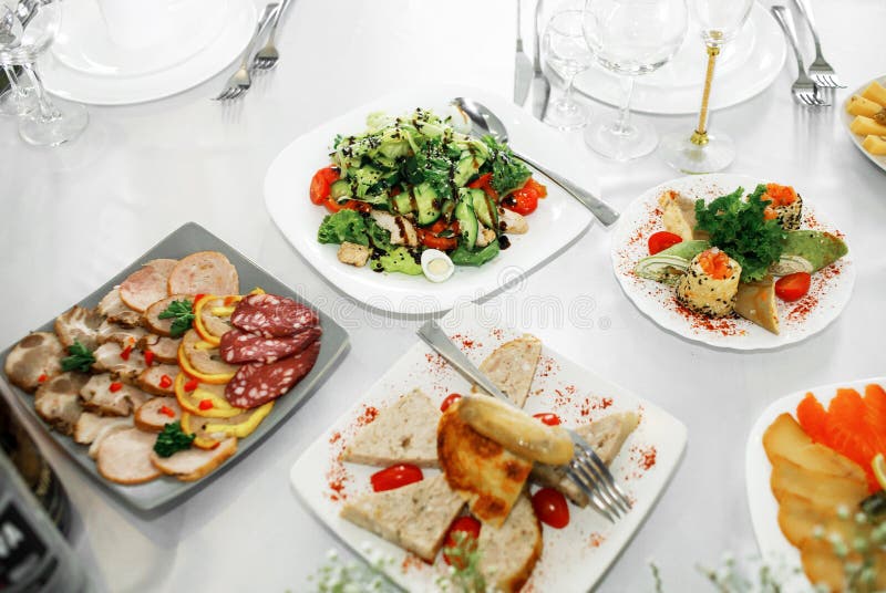 Fish Dishes on the Banquet Table, Logos, Snacks, Vegetables Stock Photo ...
