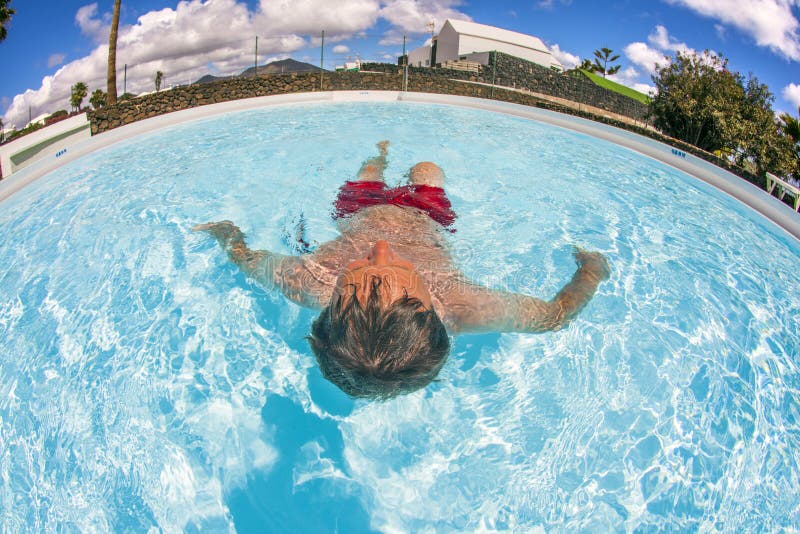 Fish-eye Image of a Man Swimming in a Pool Stock Image - Image of face ...