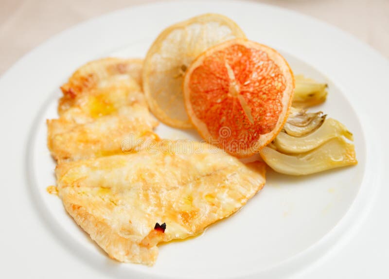 Fish Fillet with Artichokes and Citrus Chips Stock Photo - Image of ...