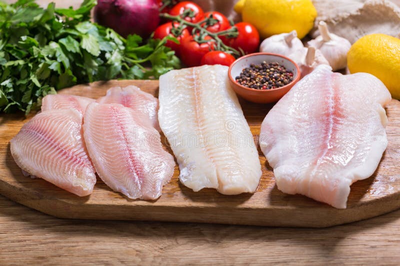 Fish Fillet of Cod, Tilapia and Pangasius with Ingredients for Cooking ...