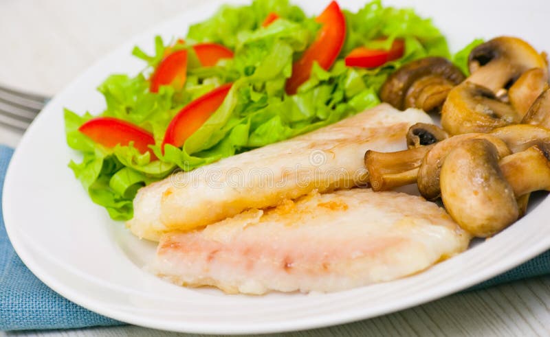 Fish Fillet with Mushrooms and Salad Stock Photo - Image of hake ...