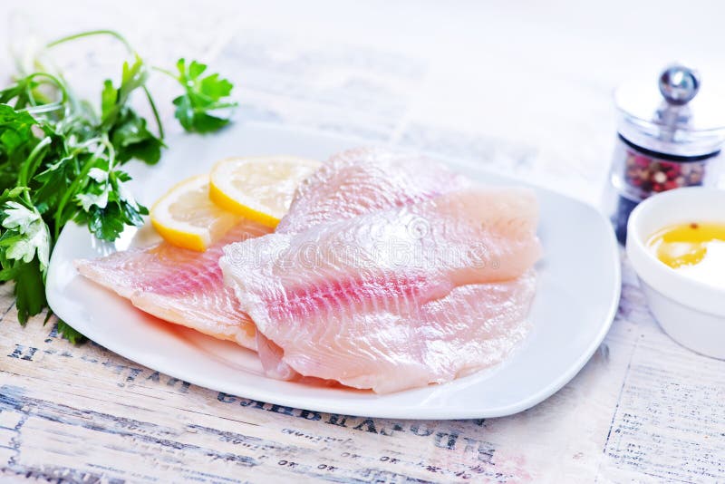 Fish fillet stock photo. Image of fragment, board, herbs - 76727200