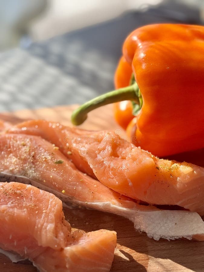 Fish fillet and red pepper stock photo. Image of plan - 372923600
